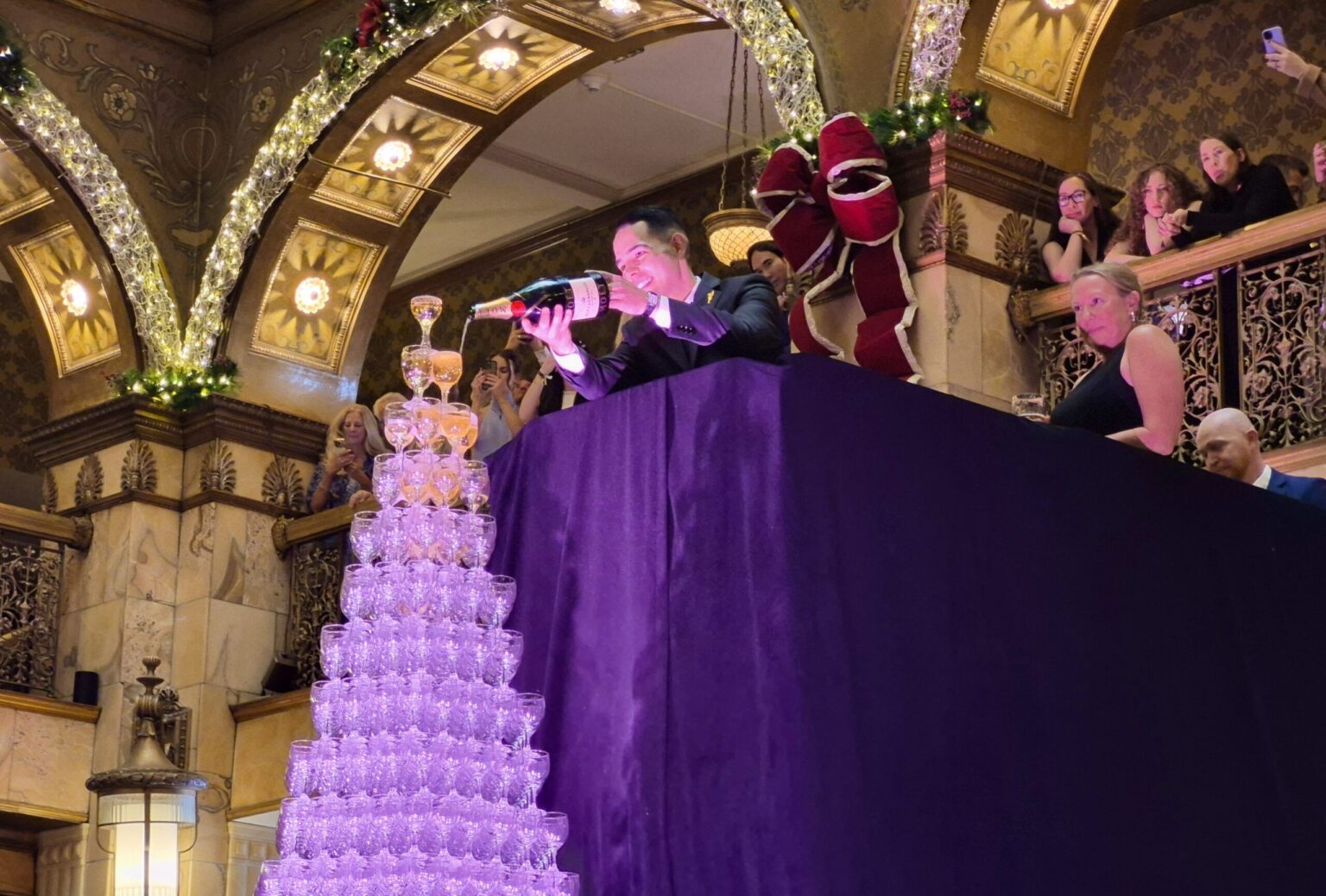 Historic Denver hotel ushers holidays with giant champagne glass tower ...